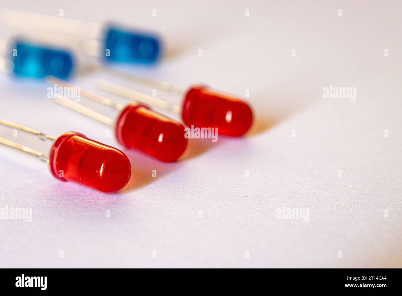 A row of Through Hole led diodes, red and blue, electronic component ...