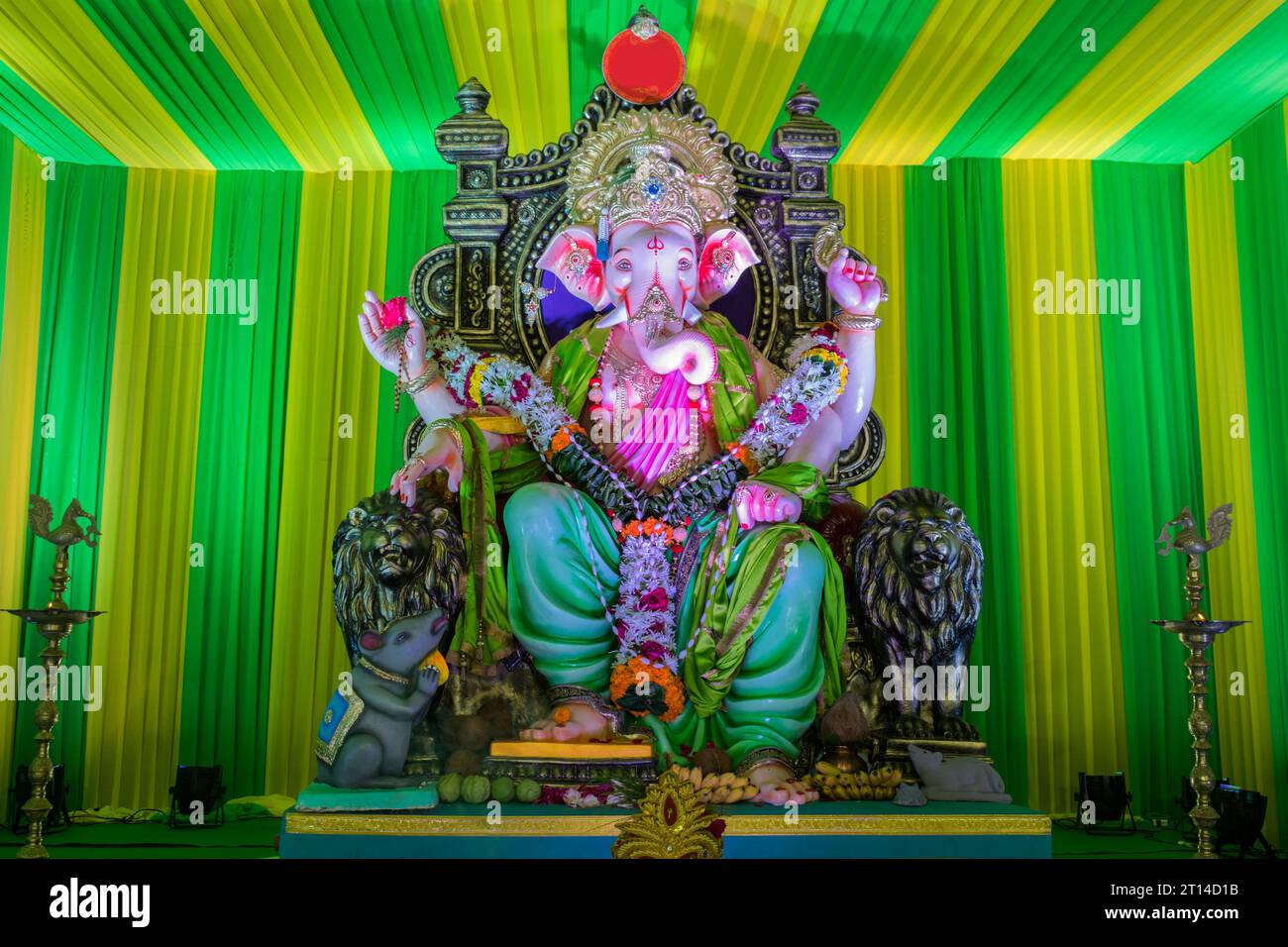 A beautiful idol of Lord Ganesha being worshipped at a mandal in Mumbai ...