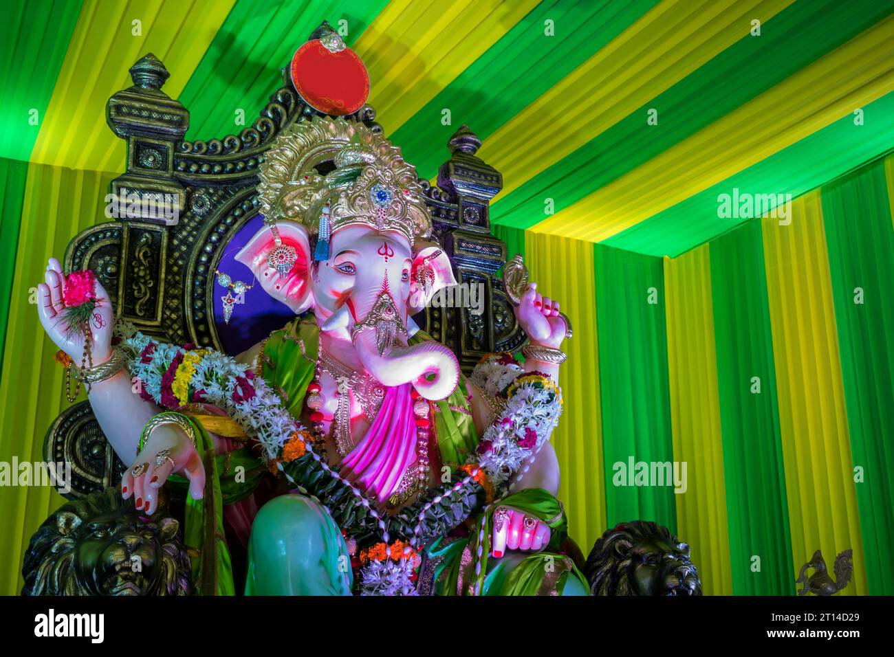 A beautiful idol of Lord Ganesha being worshipped at a mandal in Mumbai ...