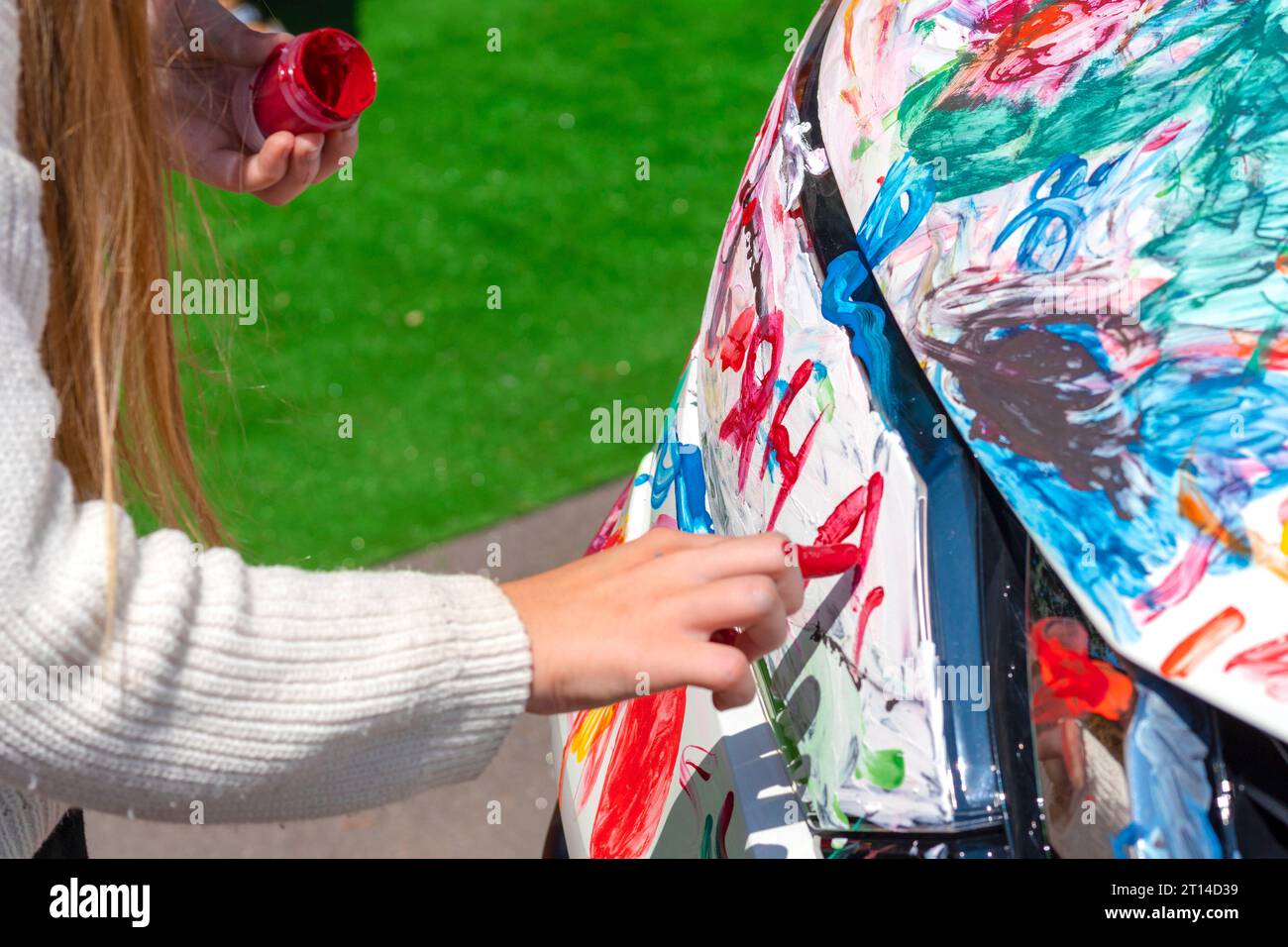 draw on a car. finger painting. outlined car. painted car Stock Photo ...