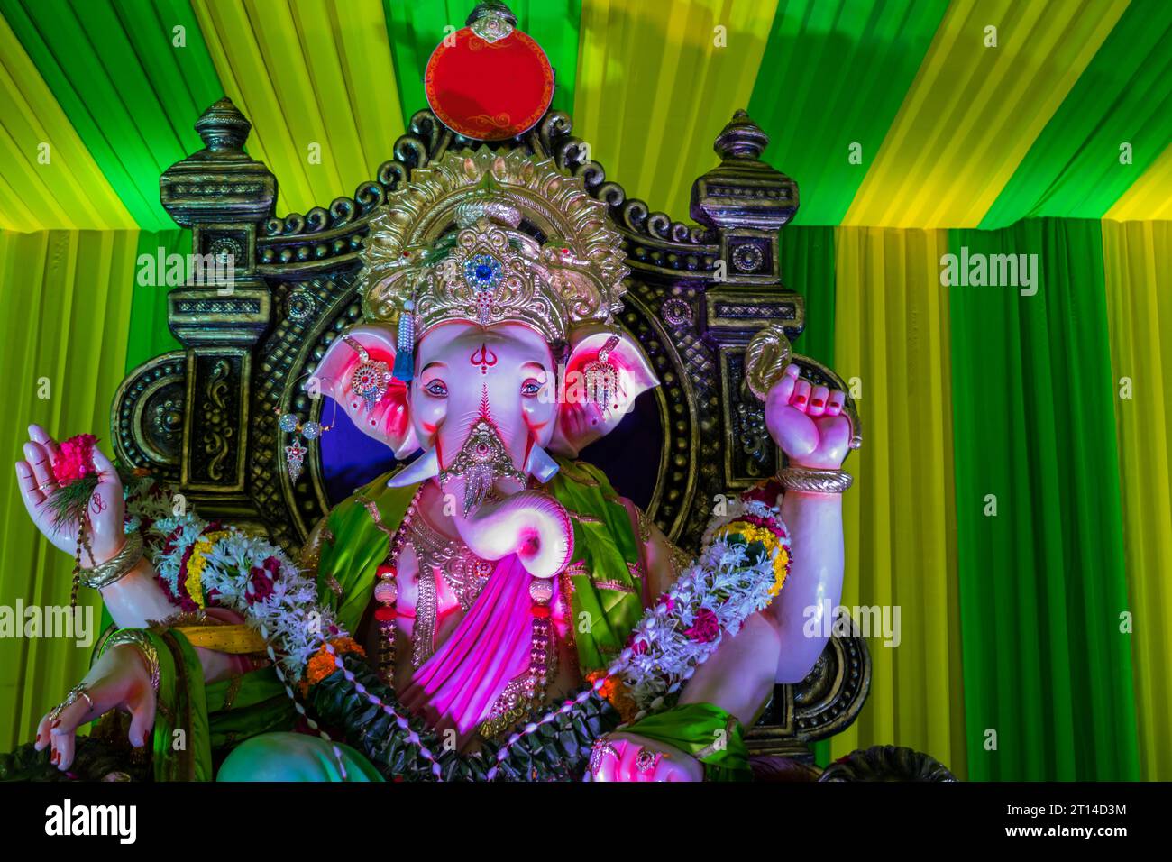 A beautiful idol of Lord Ganesha being worshipped at a mandal in Mumbai ...