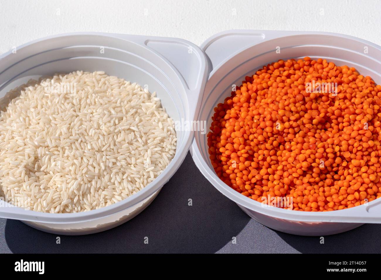 Millet groats. plastic plate with cereal. Vegetarian food . close-up ...