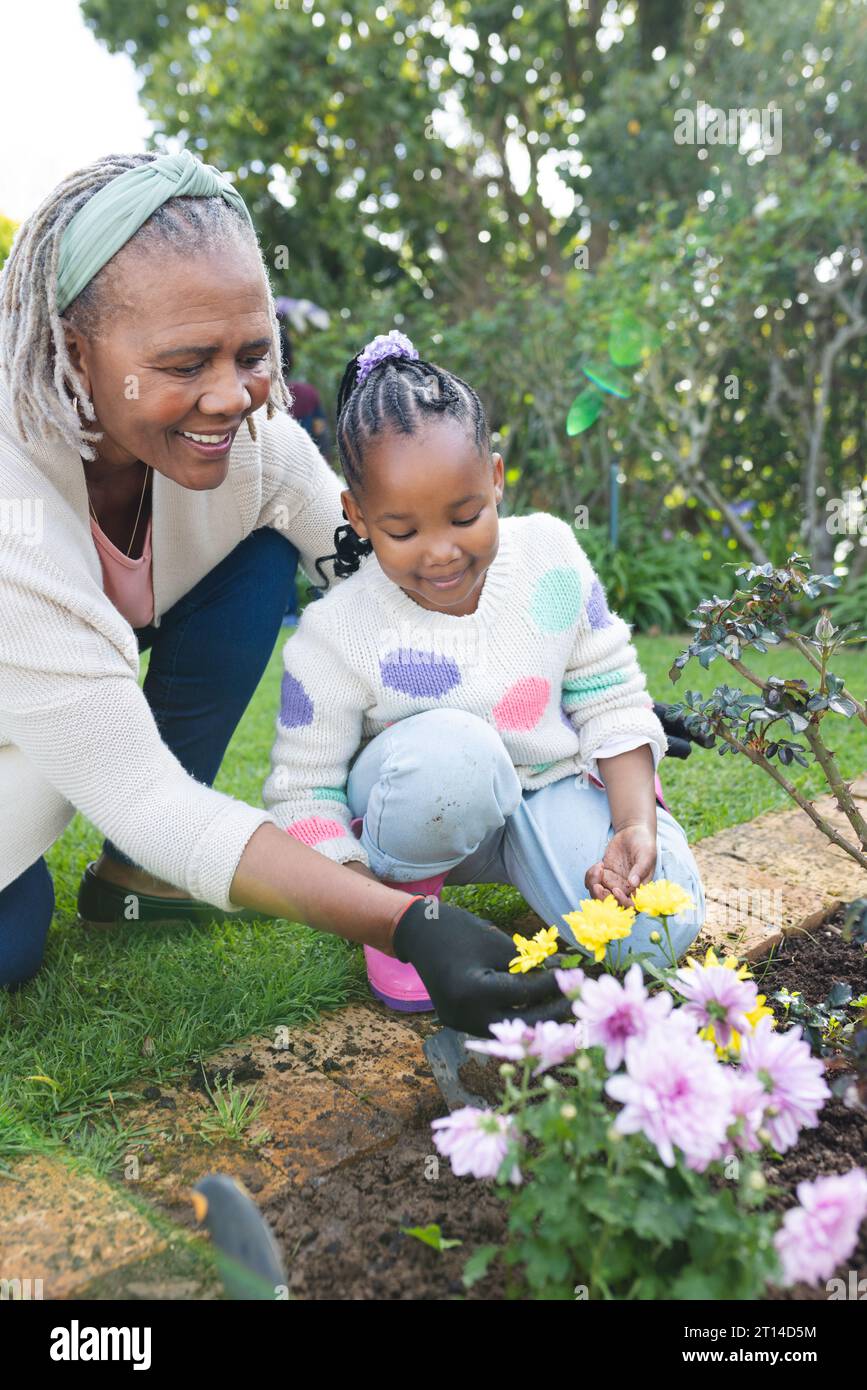 Happy African American Grandmother And Granddaughter Taking Care Of