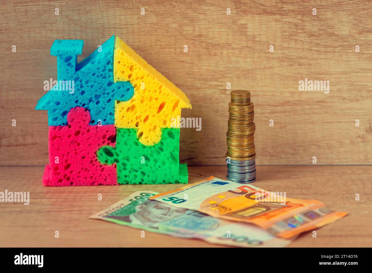 House with slide, pyramid of coins. Concept purchase, rent of housing ...