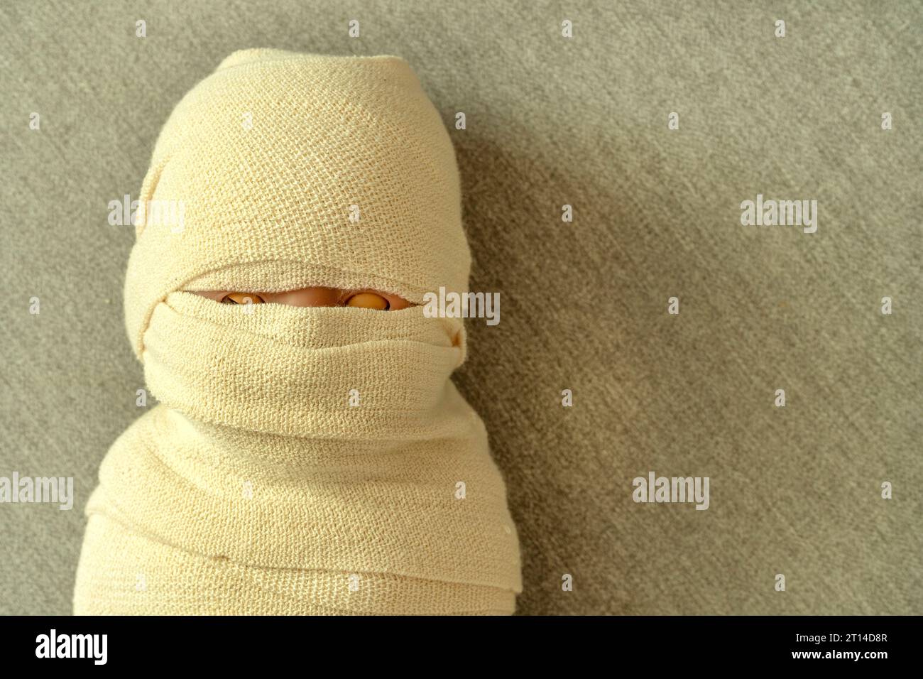 The man is wrapped in a cloth. The body is shrouded in a veil. The ...