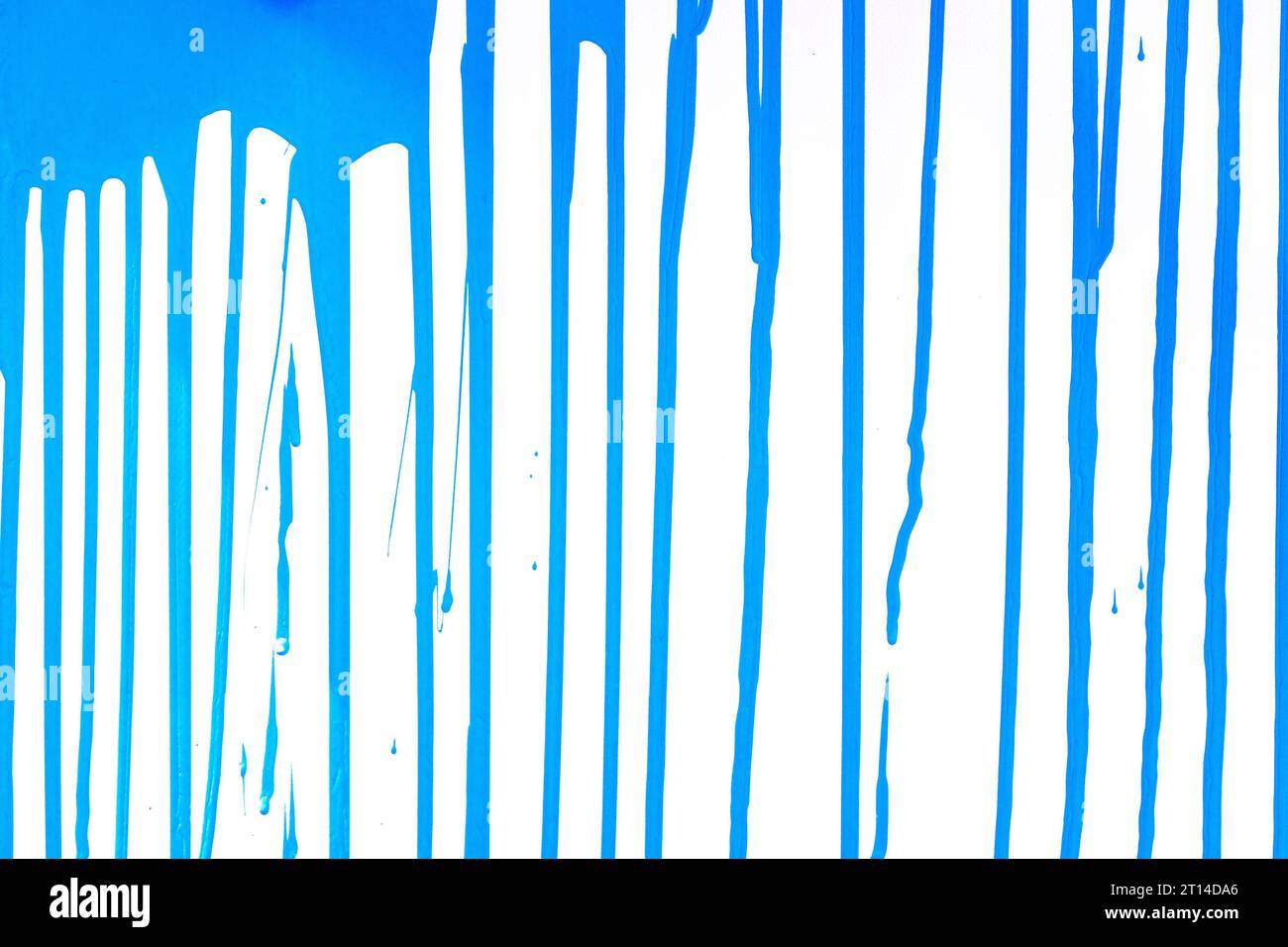 Paint streams on a light blue surface. A background with strips from ...