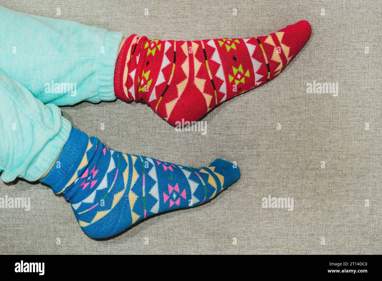 Women's legs in different beautiful socks. Colored socks on a ...