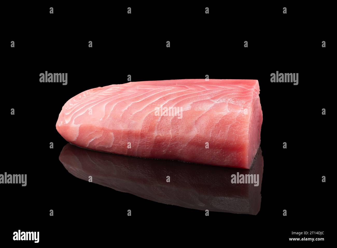 Yellow fin tuna steak isolated on black background. Fresh rare tuna ...