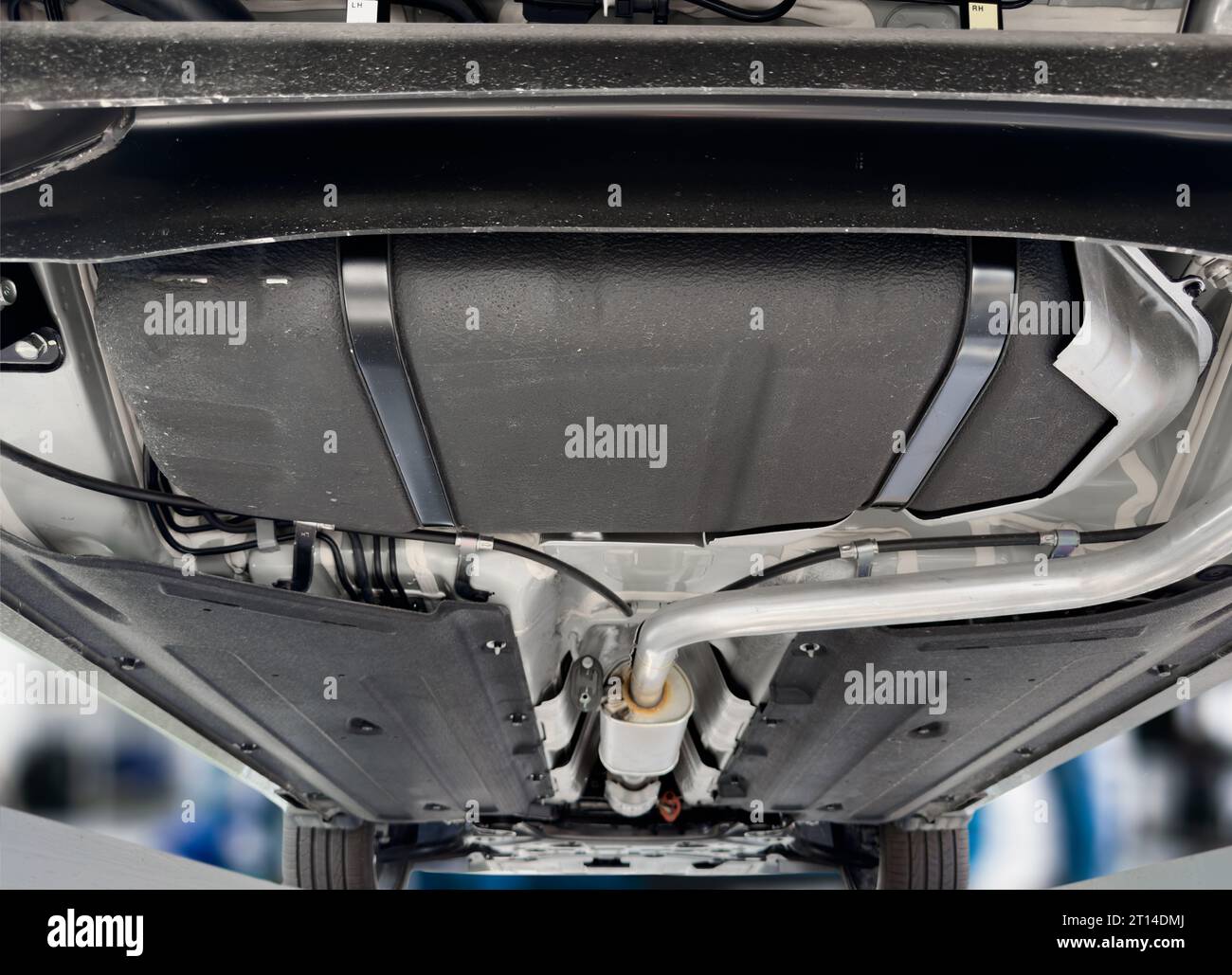 Modern car in a car service on a lift. Bottom view suspension of the ...
