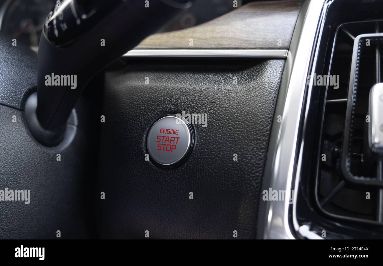 Car dashboard with focus on engine start stop button. Modern car ...