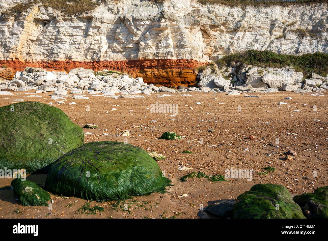 Colourful sandstone cliffs on british beach in england uk Stock Photo ...