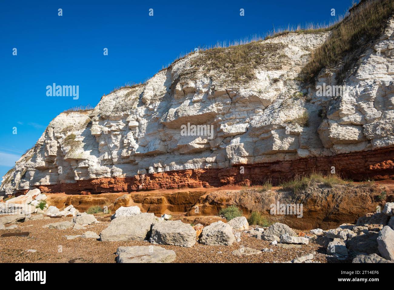 Colourful sandstone cliffs on british beach in england uk Stock Photo ...
