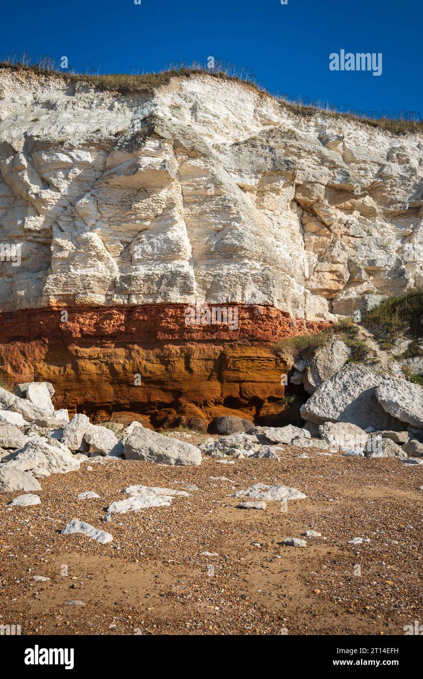 Colourful sandstone cliffs on british beach in england uk Stock Photo ...