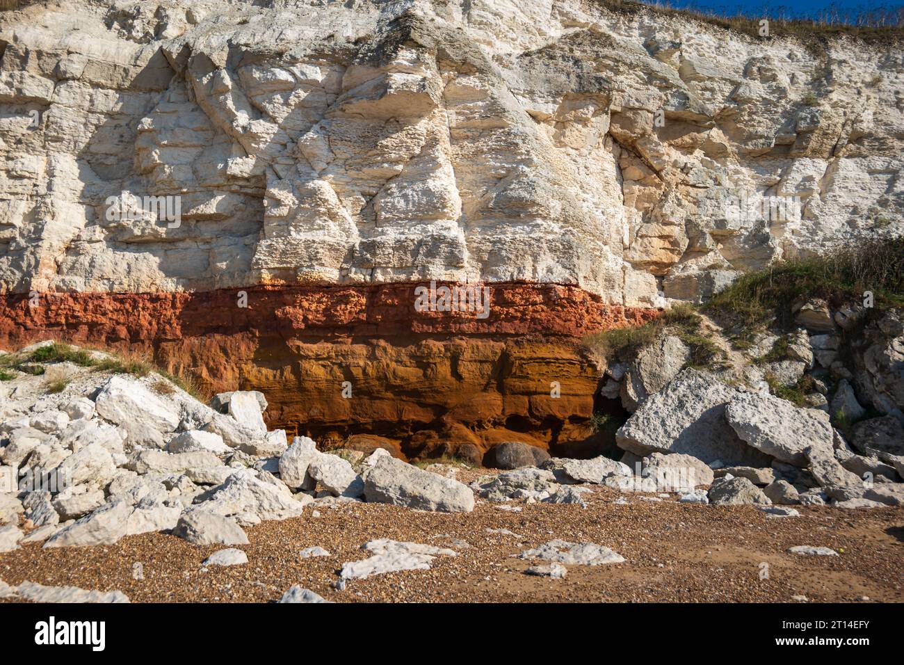 Colourful sandstone cliffs on british beach in england uk Stock Photo ...