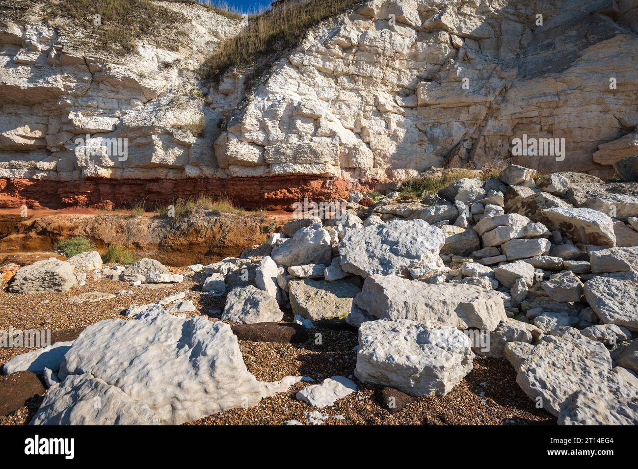 Colourful sandstone cliffs on british beach in england uk Stock Photo ...