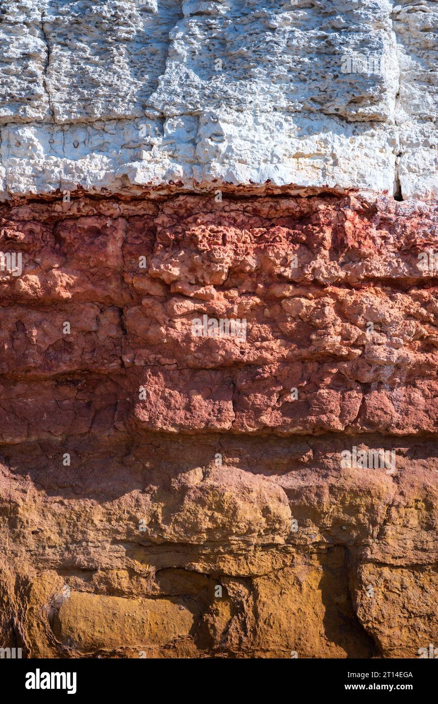 Colourful sandstone cliffs on british beach in england uk Stock Photo ...