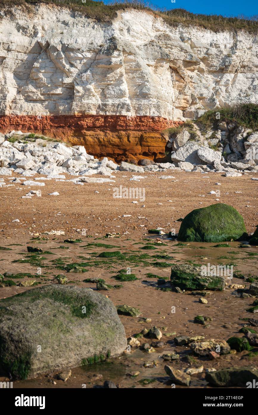 Colourful sandstone cliffs on british beach in england uk Stock Photo ...