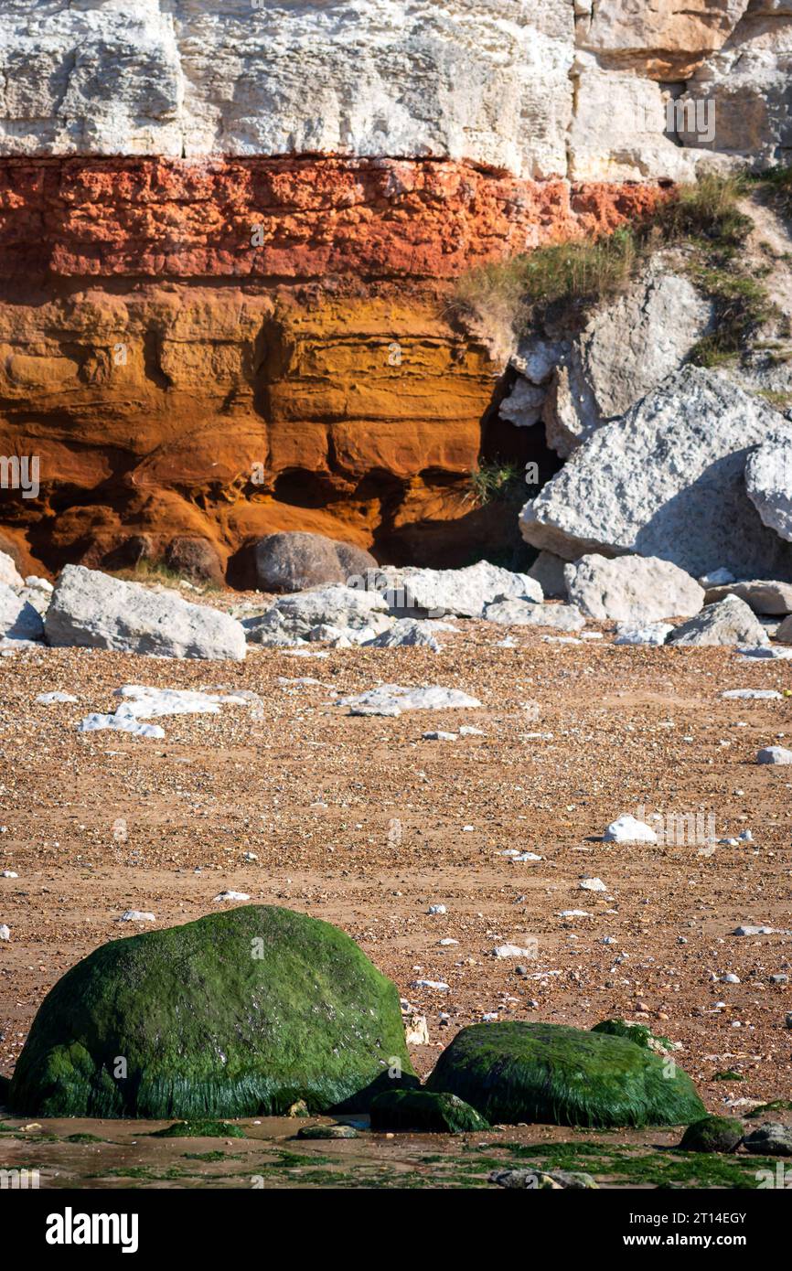 Colourful sandstone cliffs on british beach in england uk Stock Photo ...