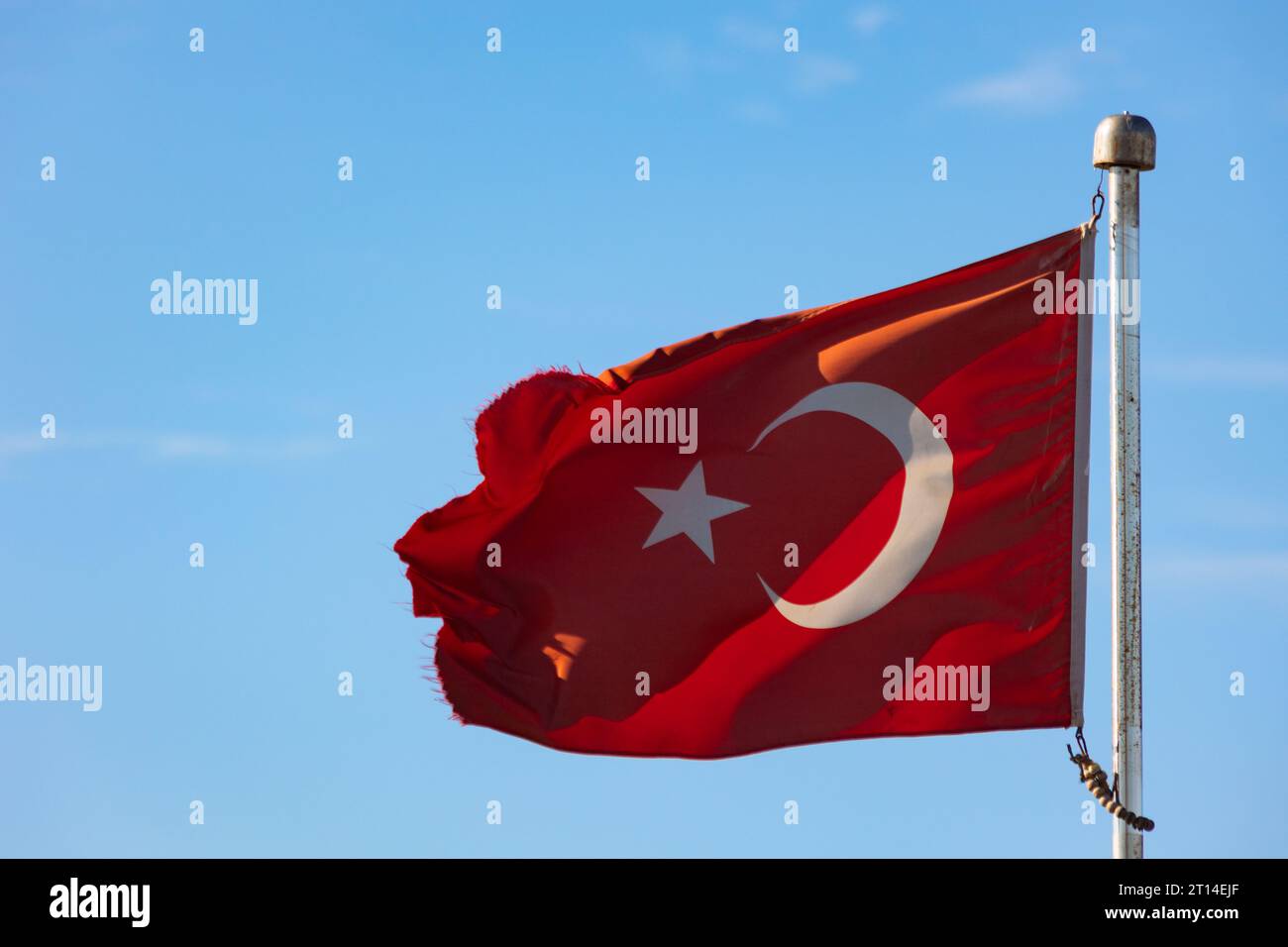 Turkish Flag aka Turk Bayragi isolated on blue sky background. Turkish ...