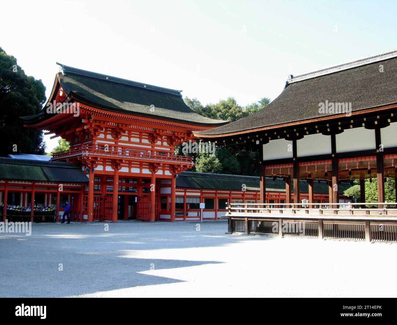 A bright red, Asian-style entrance to a building, featuring a majestic ...