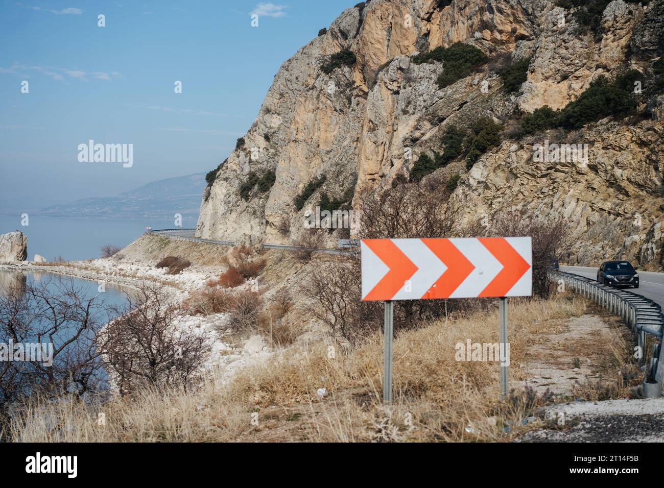 Yellow road sign warning sharp hi-res stock photography and images - Alamy
