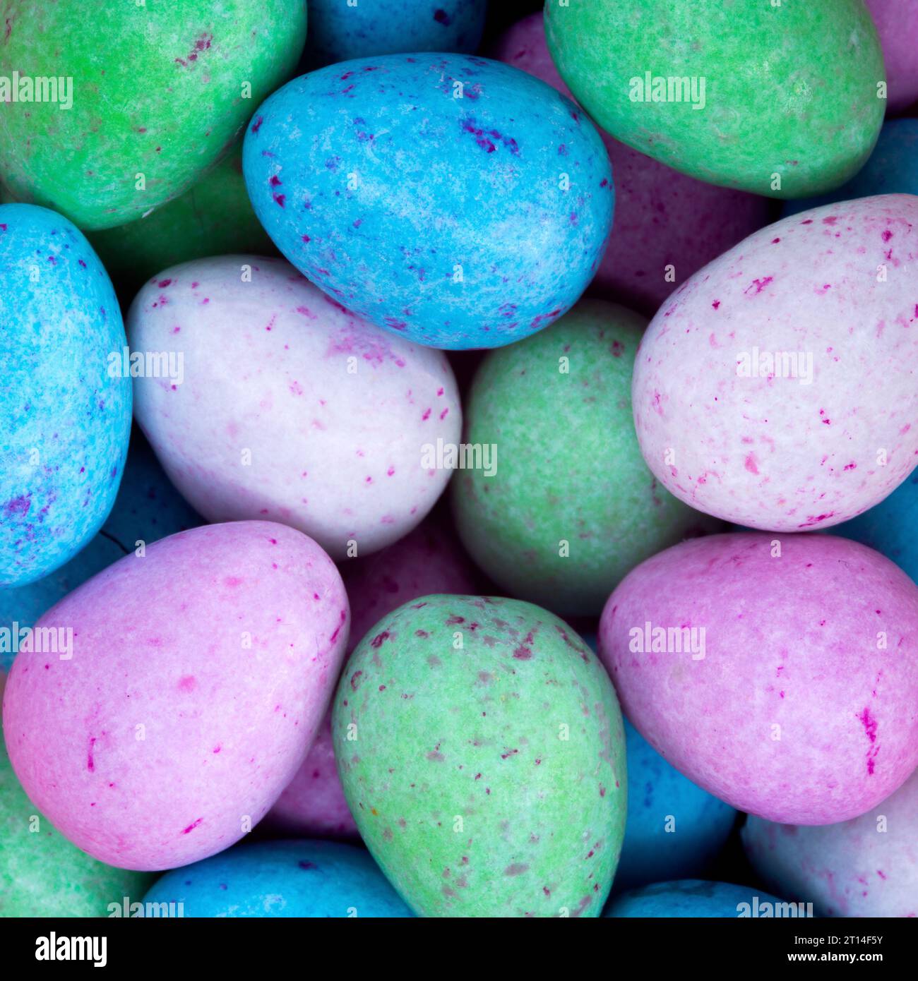 Vibrant and colourful mini milk chocolate eggs with speckled and sweet ...