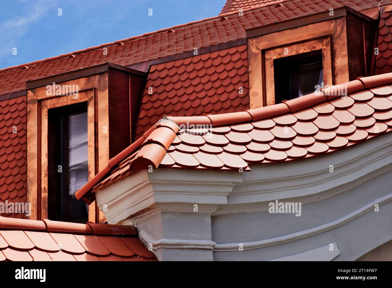 beavertail clay tile sloped residential Mansard roof. bright shiny new ...