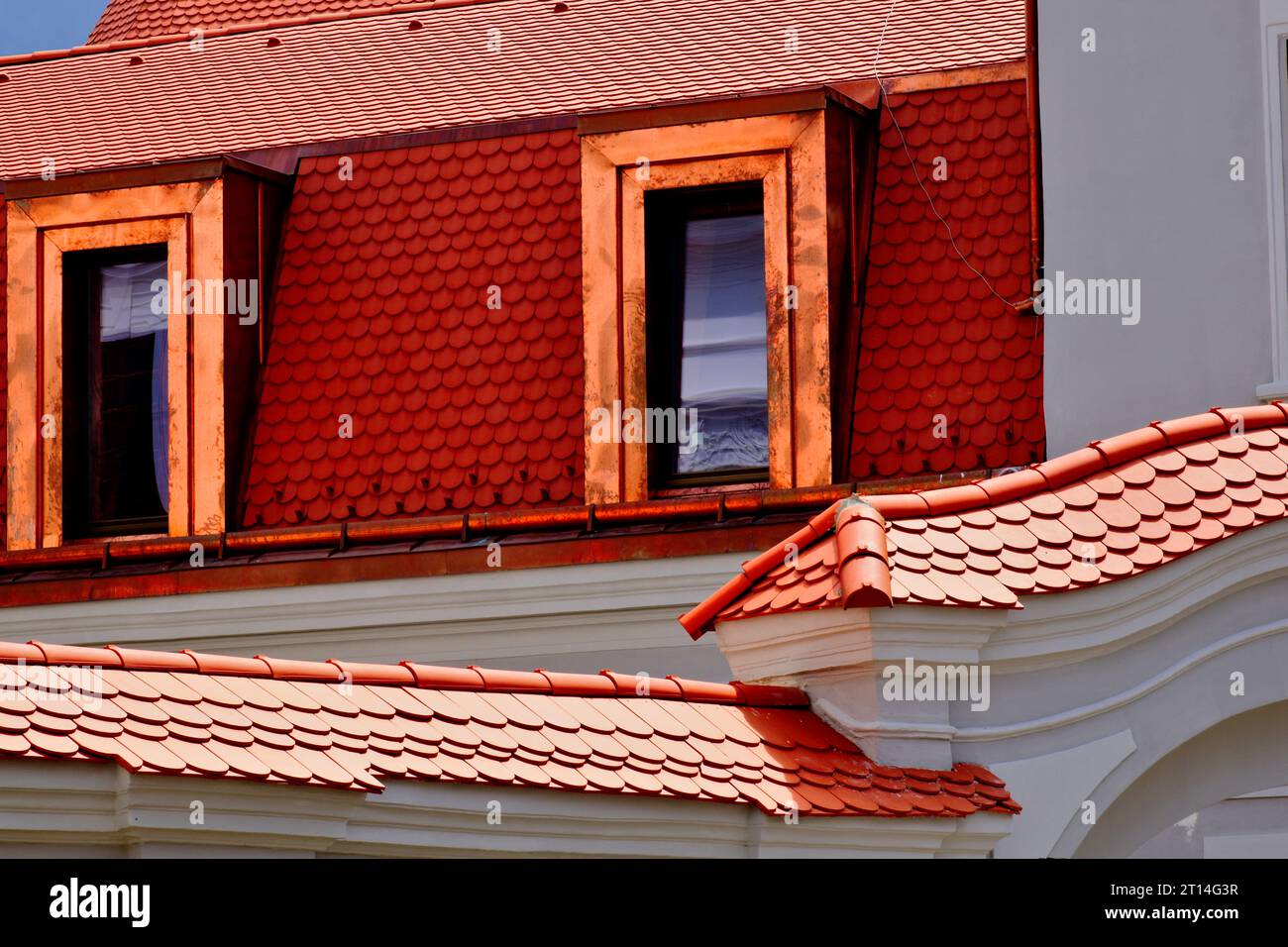 beavertail clay tile sloped residential Mansard roof. bright shiny new ...