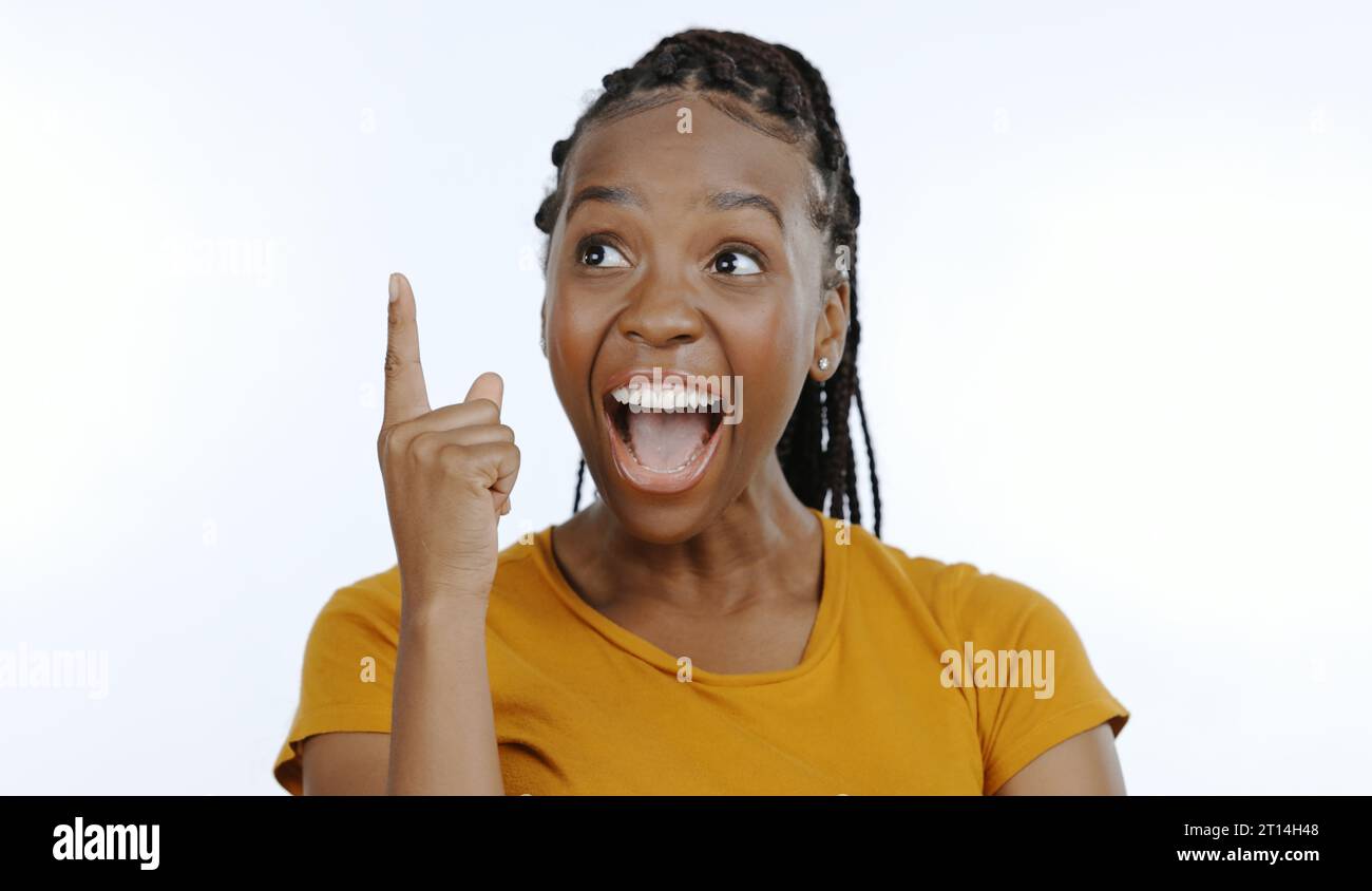 Hand, idea and aha with an excited black woman in studio on a white ...