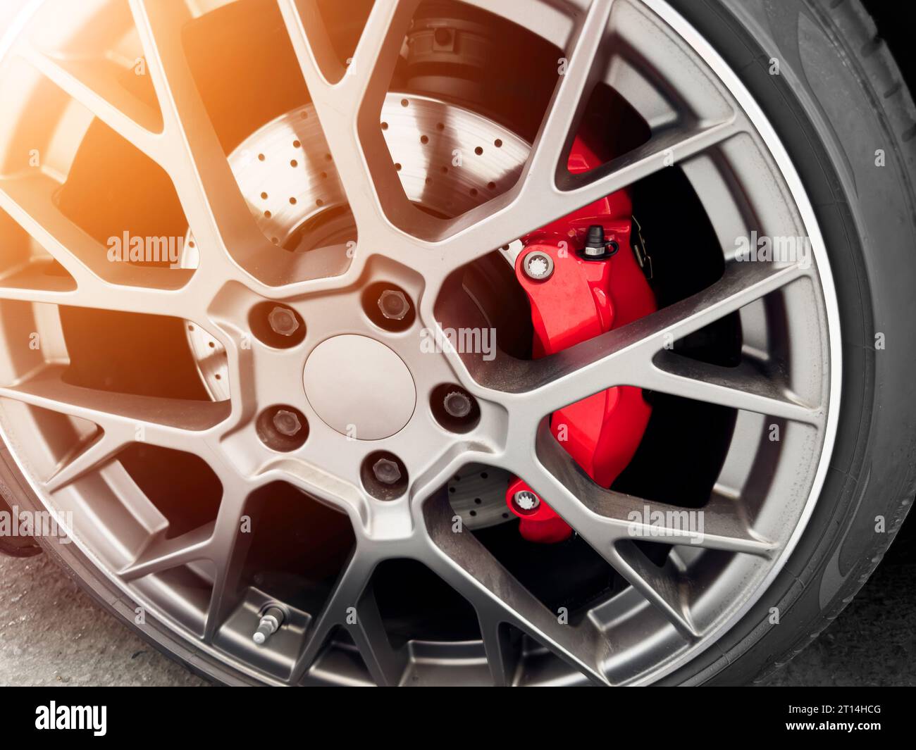 Car alloy wheel and tyre. New alloy wheel with tire and red carbon ...