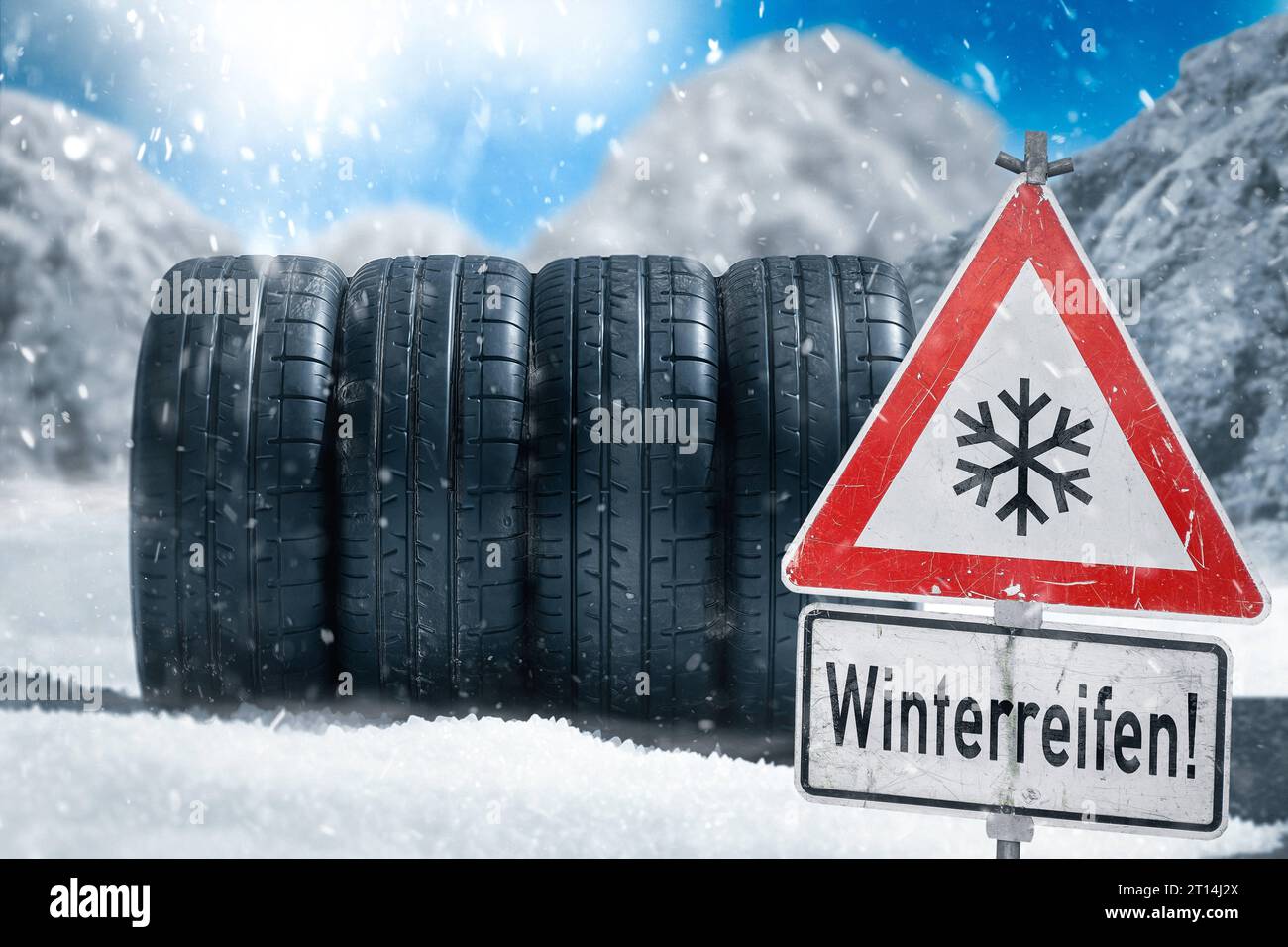 11 October 2023: Winter tires on a country road in snowfall with ...