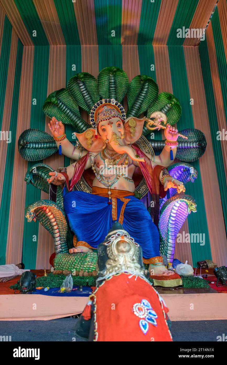 A beautiful idol of Lord Ganesha being worshipped at a mandal in Mumbai ...