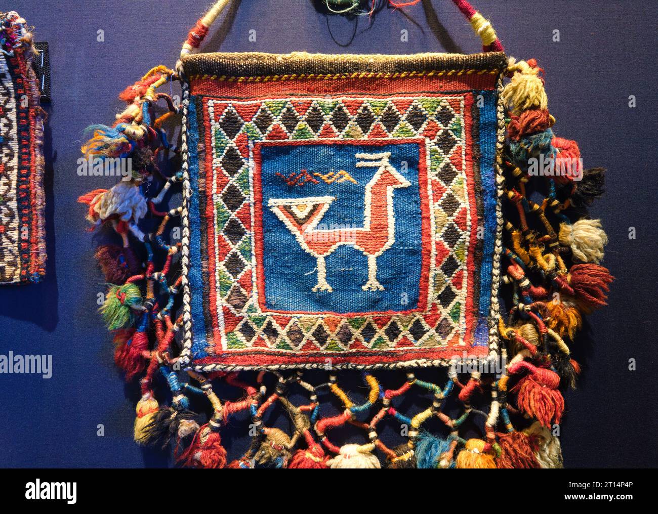 Interior view in the display galleries of a small, hanging weaving of a ...