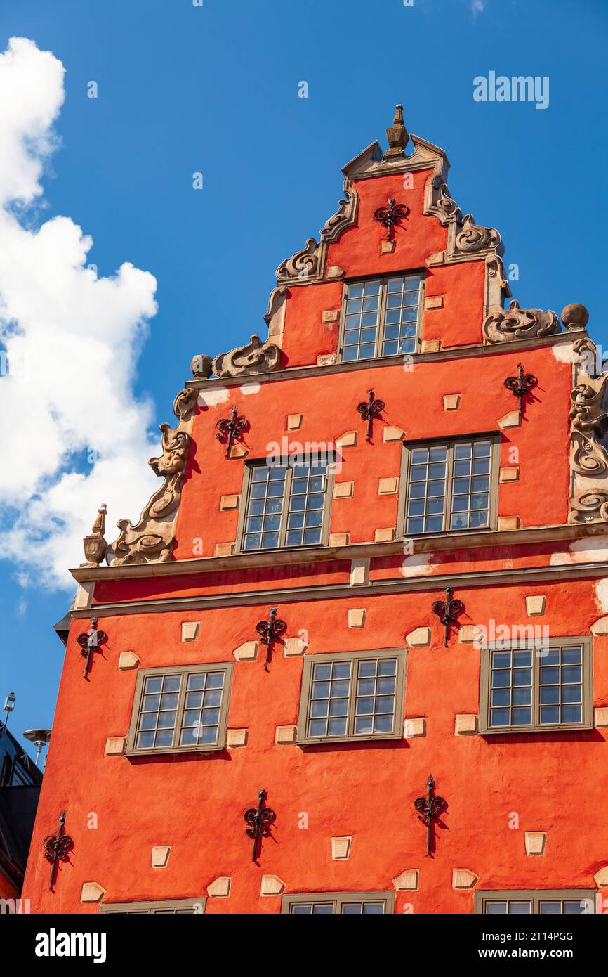 Colorful stepped gable facade of historic building on Stortorget public ...