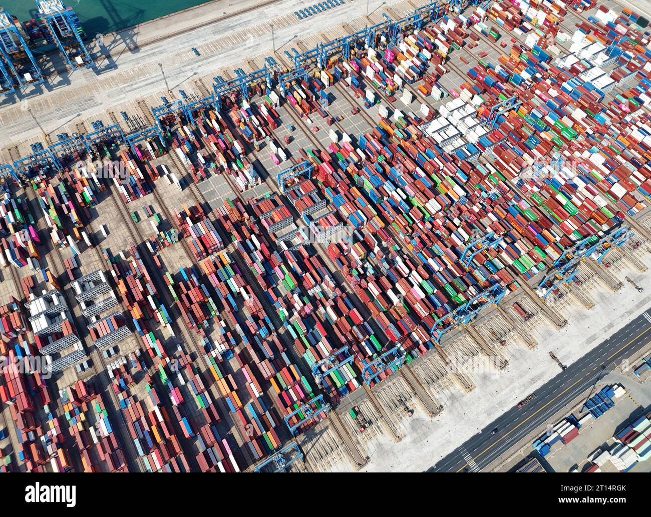 QINGDAO, CHINA - OCTOBER 11, 2023 - Rail lifts shuttle cargo at a ...