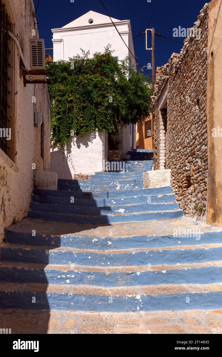 Colorful facades of traditional Greek multi-colored houses on a narrow ...