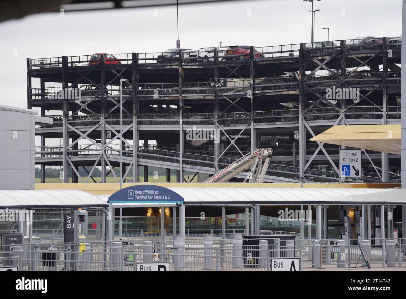 The burnt out shells of cars, buried amongst debris of a multi-storey ...