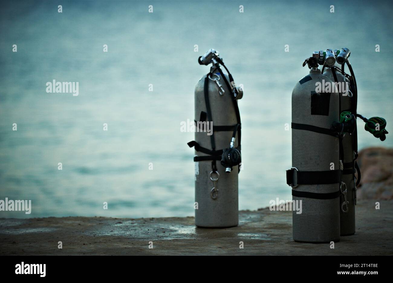 Collection of grey scuba diving air oxygen tanks waiting lined up Stock ...
