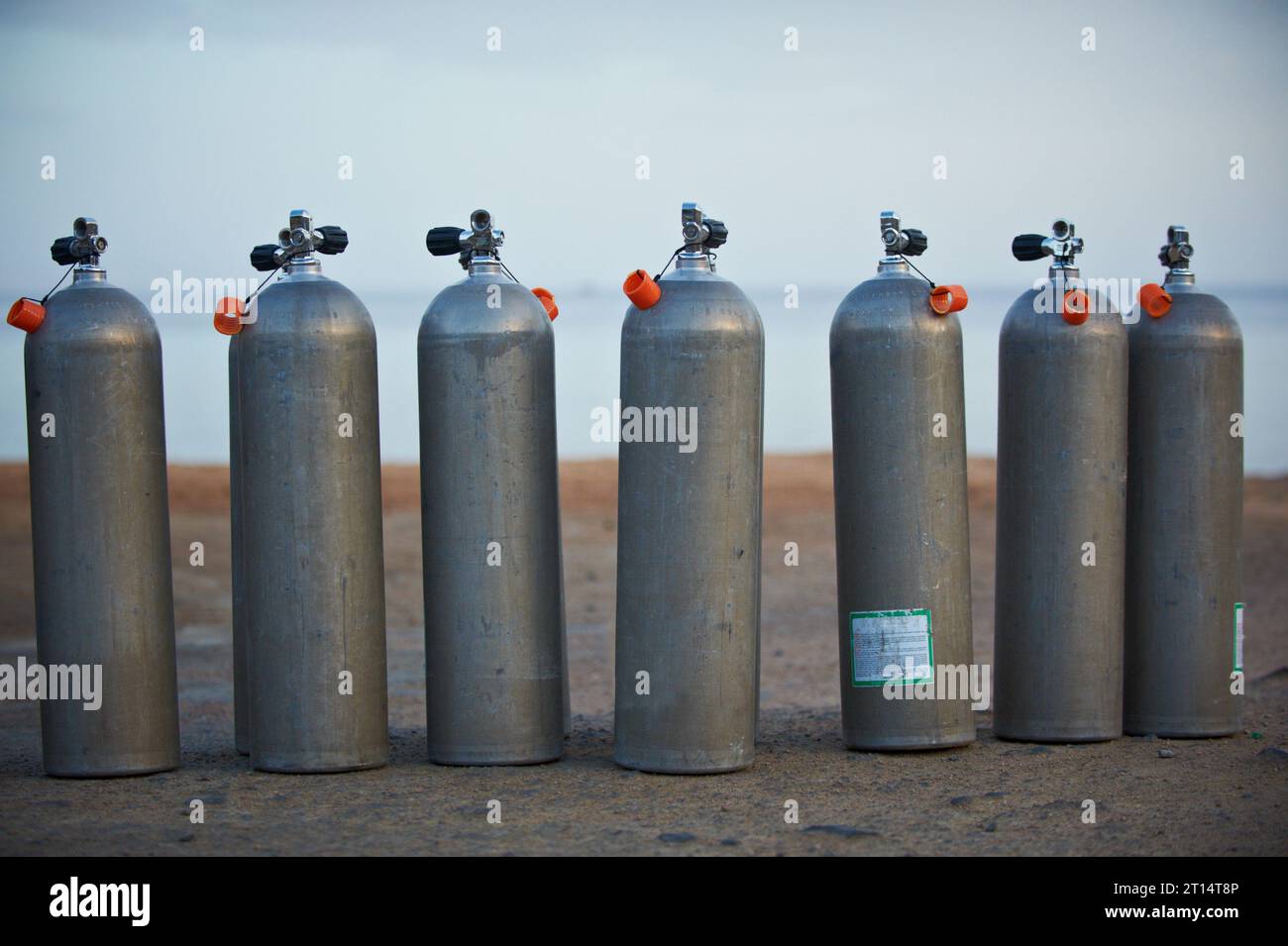 Collection of grey scuba diving air oxygen tanks waiting lined up Stock ...