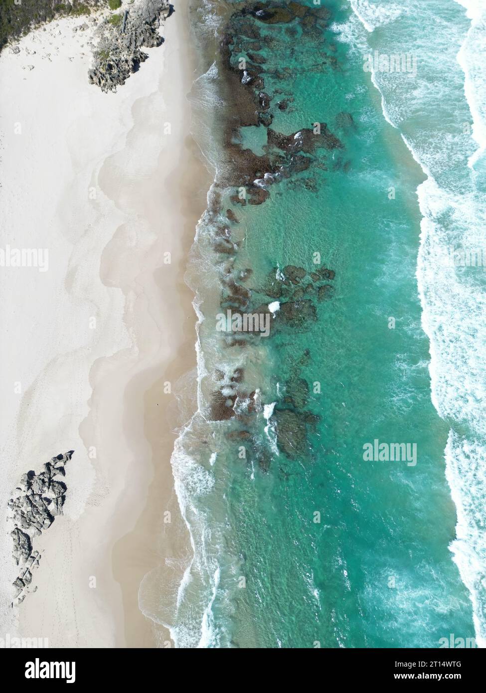 An aerial view of a shore with teal waters in Denmark, Great Southern ...