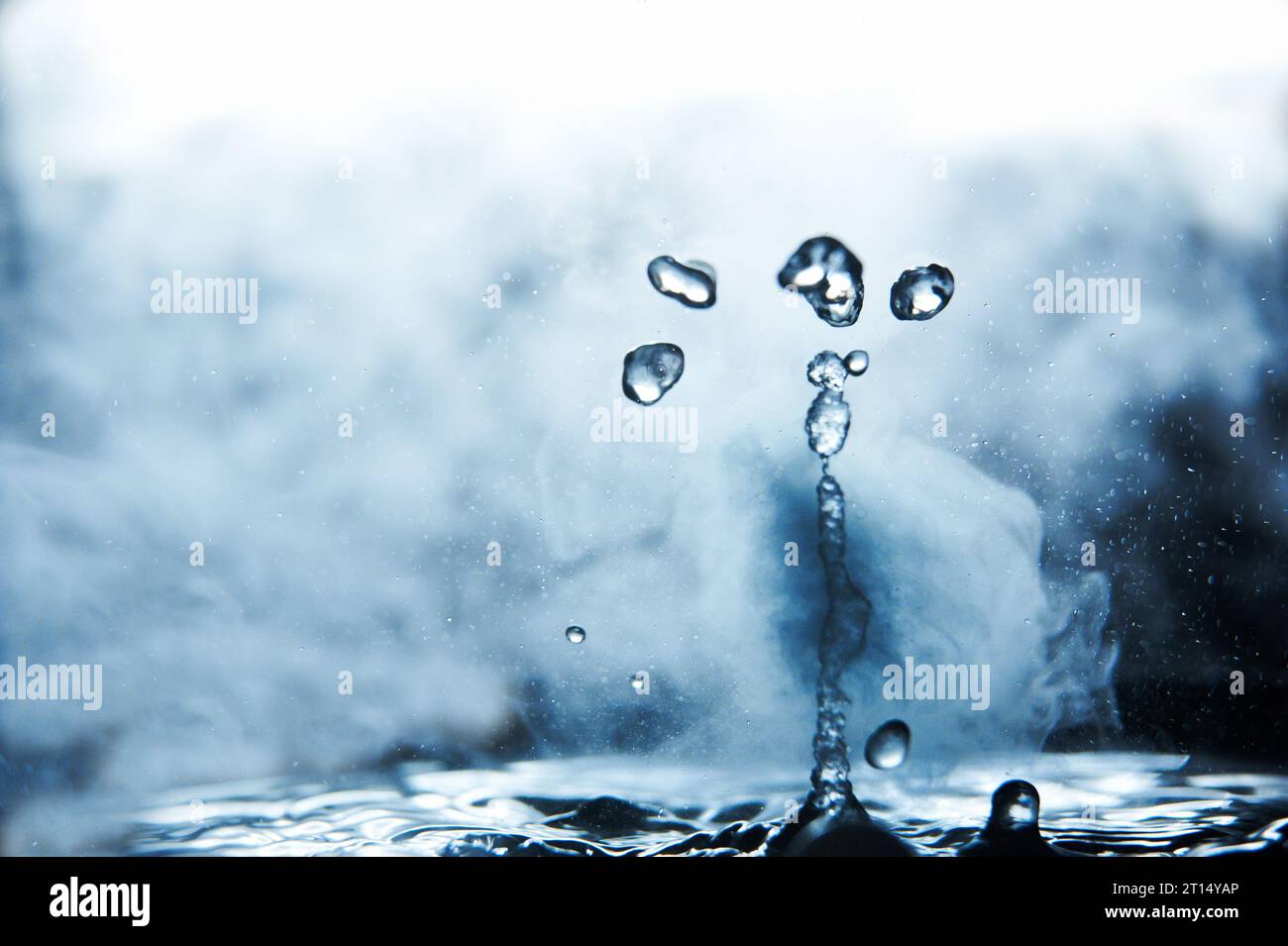 Boiling water splash with steam on black background closeup Stock Photo ...