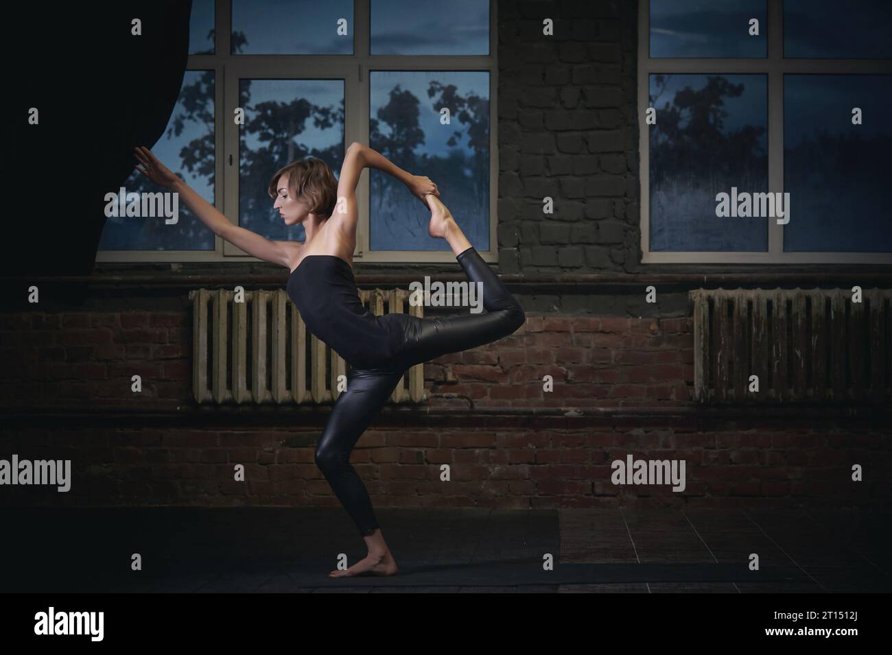 Beautiful sporty fit yogi woman practices yoga asana Natarajasana ...