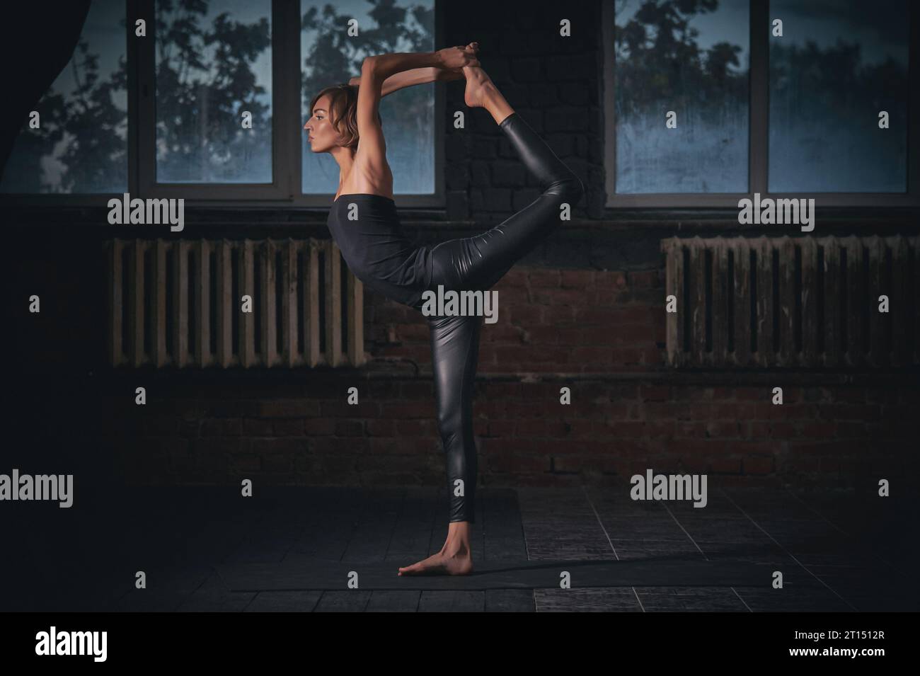 Beautiful sporty fit yogi woman practices yoga asana Natarajasana ...