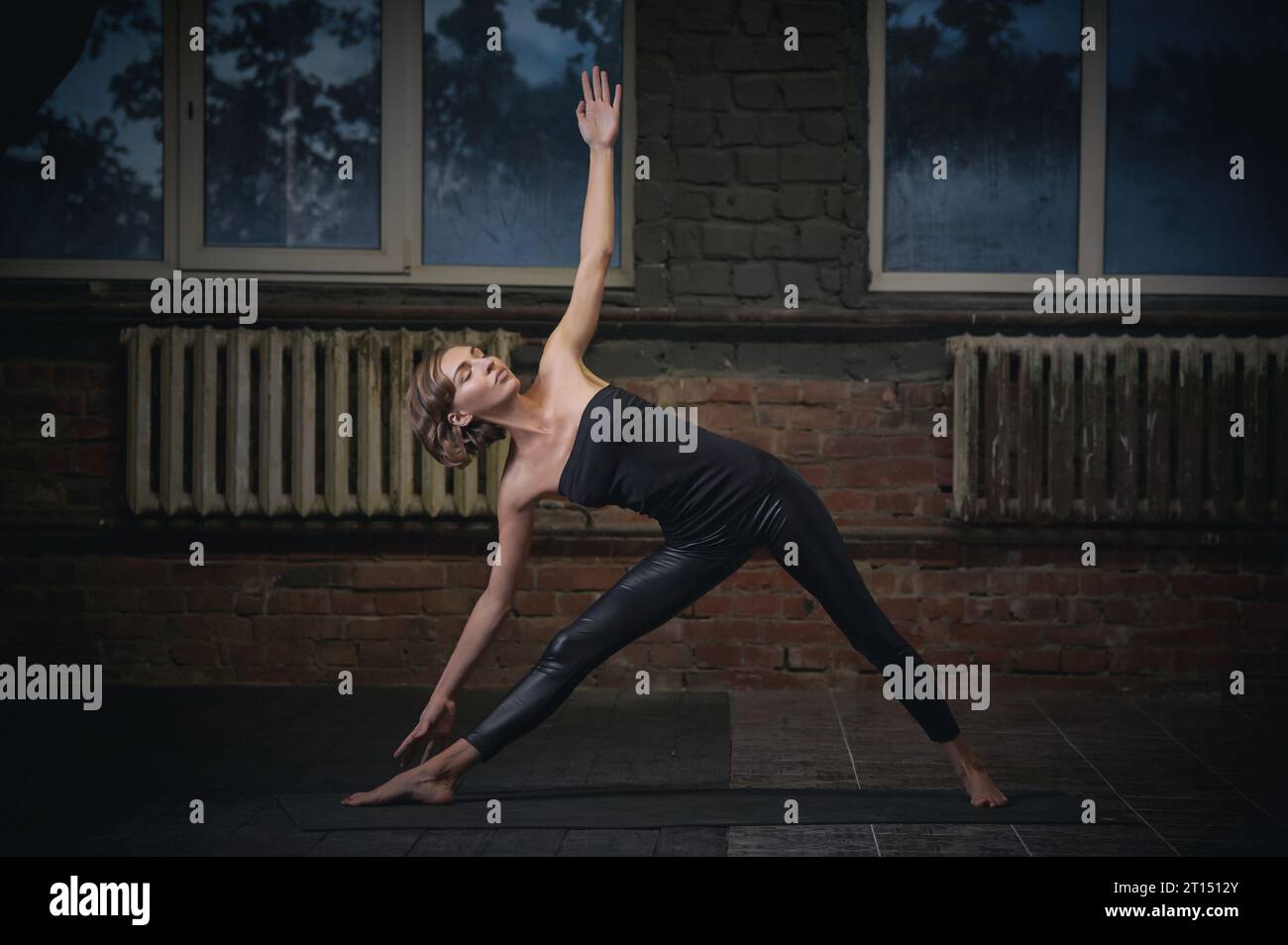 Beautiful sporty fit yogini woman practices yoga asana Utthita ...