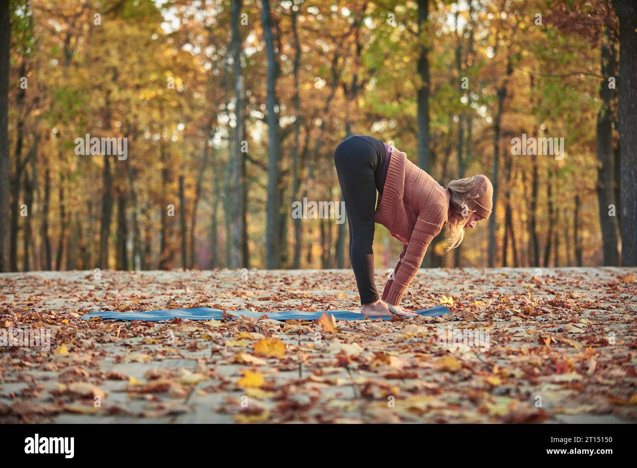 Beautiful young woman practices yoga asana Ardha Uttanasana - Half ...