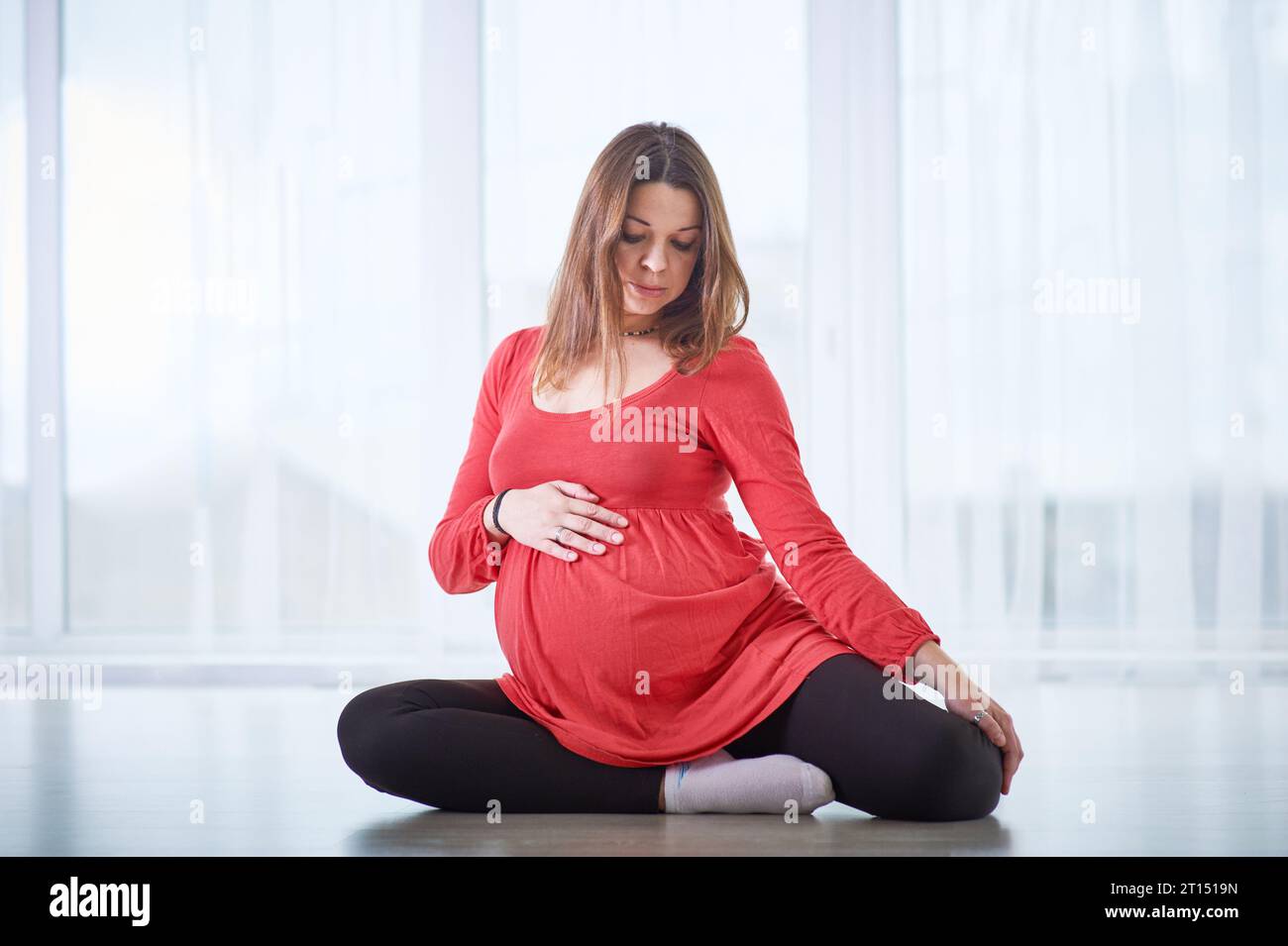 Young beautiful pregnant woman doing yoga asana Vamadevasana - Pose for ...