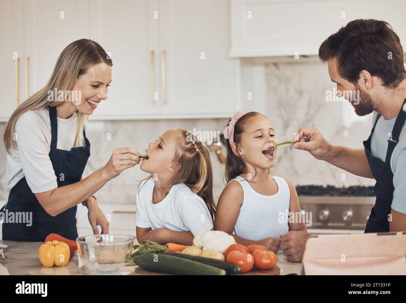 Kitchen, kids and parents with cooking, eating and ingredients with ...