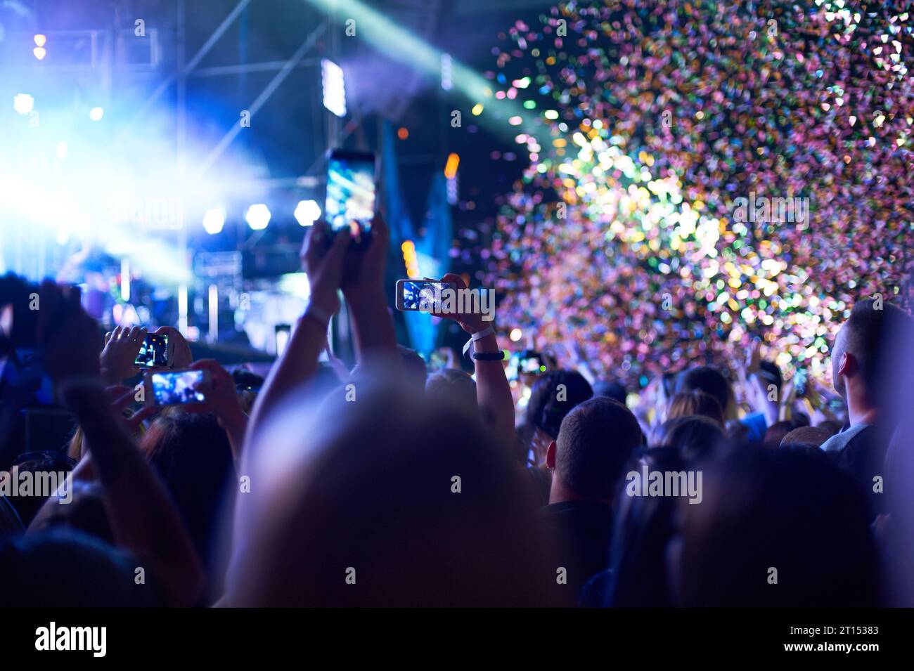 Crowd of audience with hands using camera phone to take pictures and ...