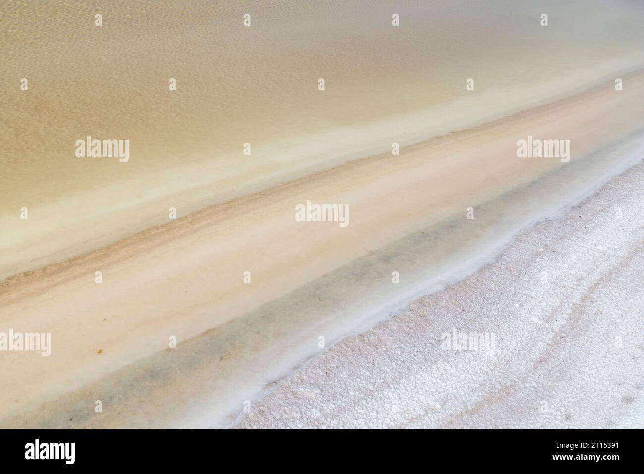 Closeup of the edge of an evaporation pond showing the gradual ...