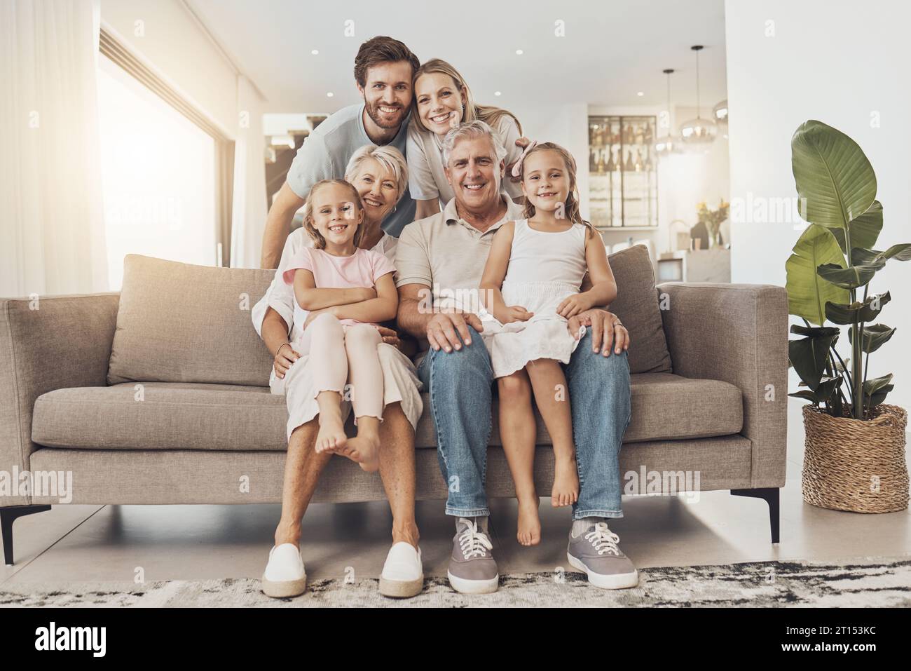 Big family, smile and portrait in home living room, support and bonding ...
